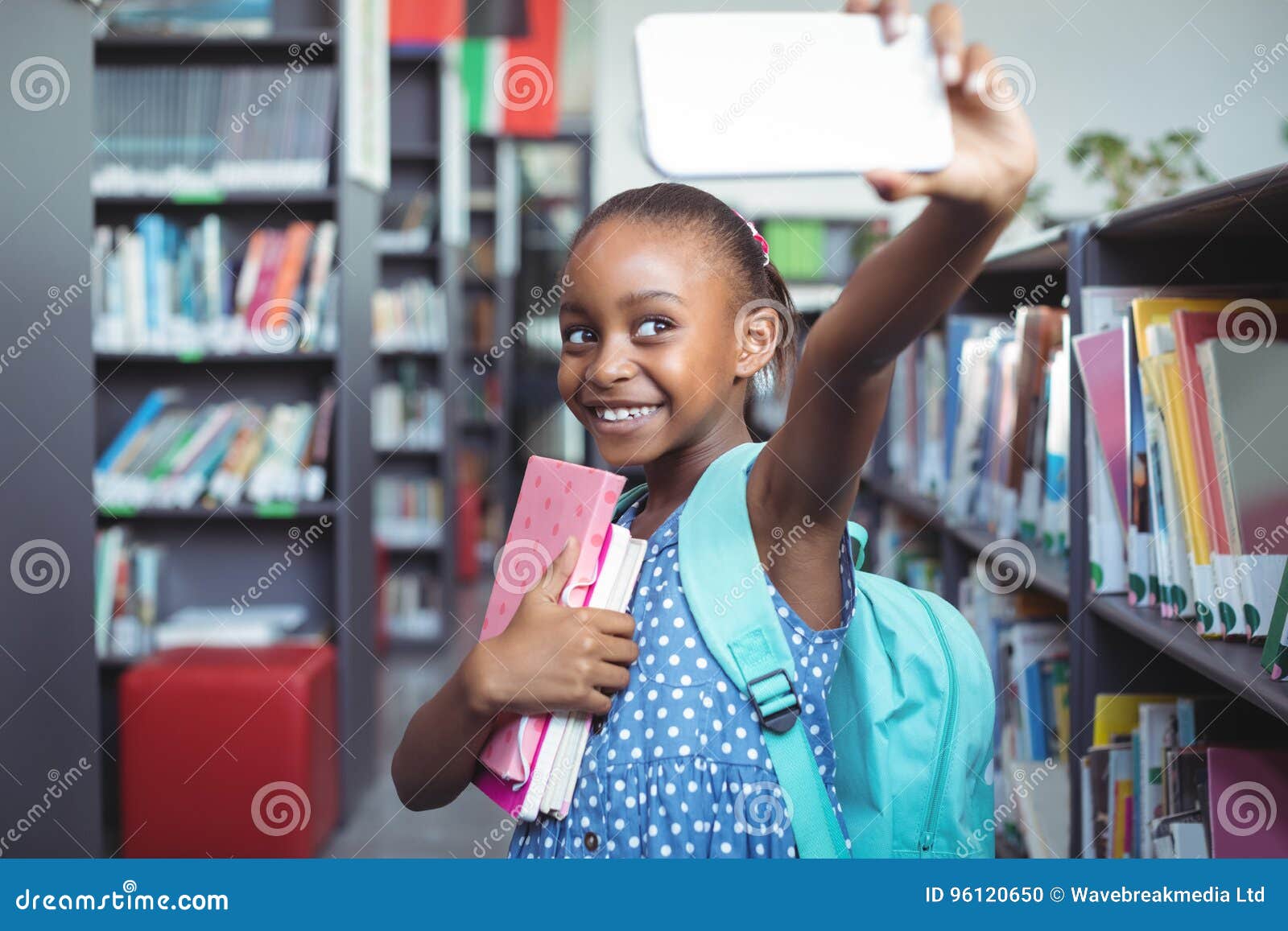 Smiling Girl Taking Selfie in Library Stock Photo - Image of selfie ...