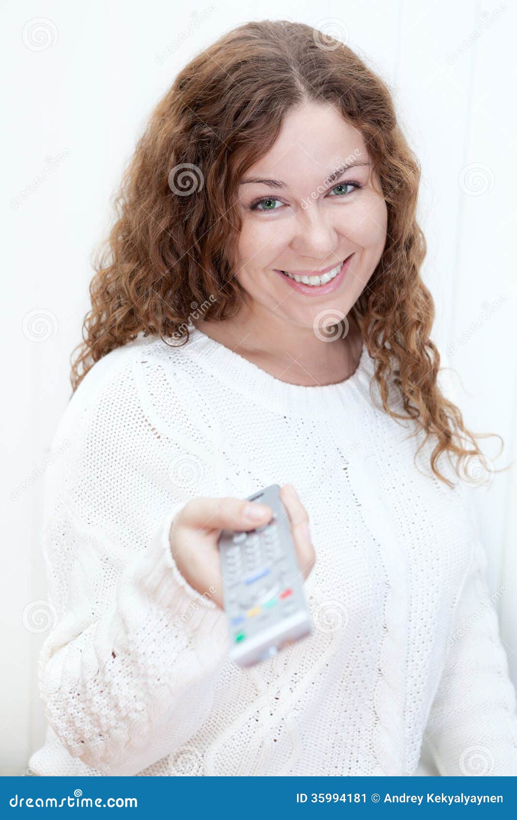 Smiling Girl with a Television Remote Control in Hand Stock Image ...