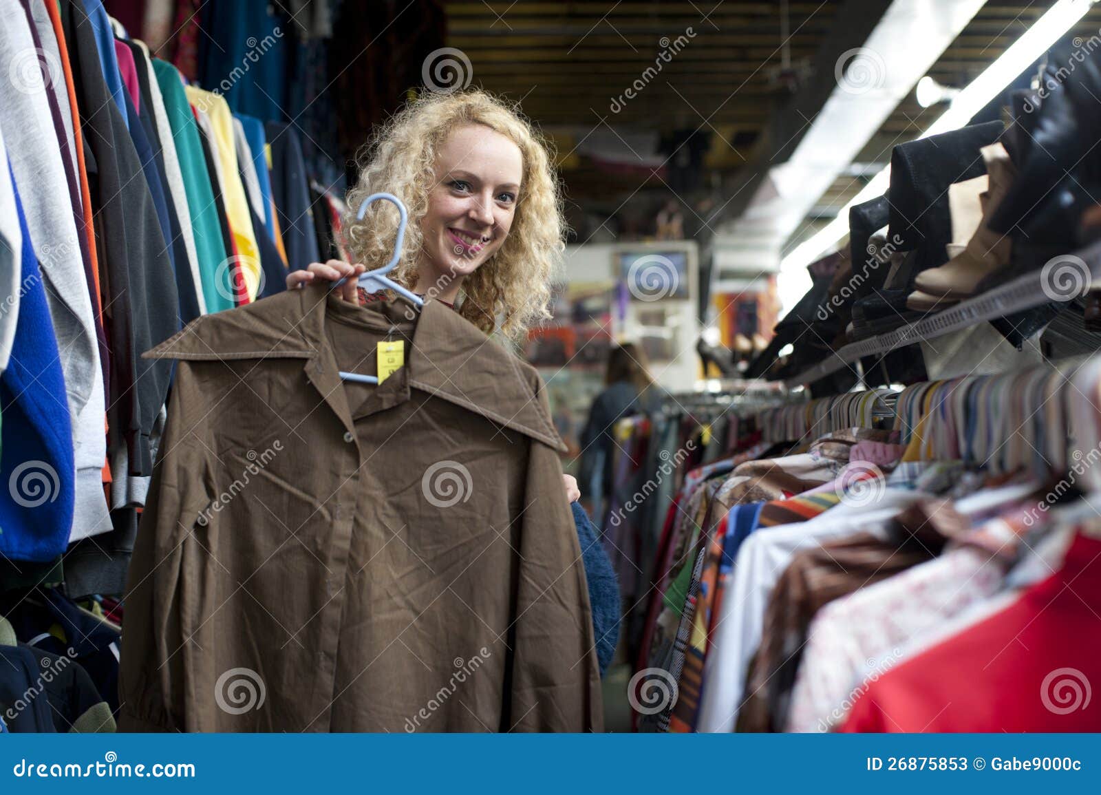 Smiling Girl in Thrift Store Stock Image - Image of fabric, tshirts ...