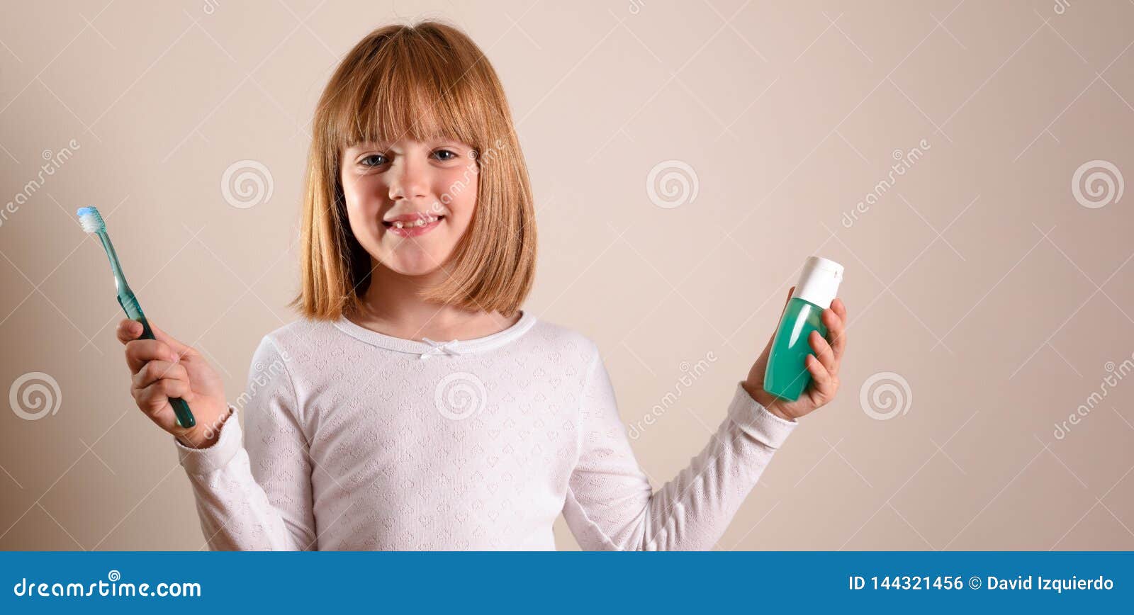 Smiling Girl with Toothbrush and Toothpaste on Isolated Brown Stock ...