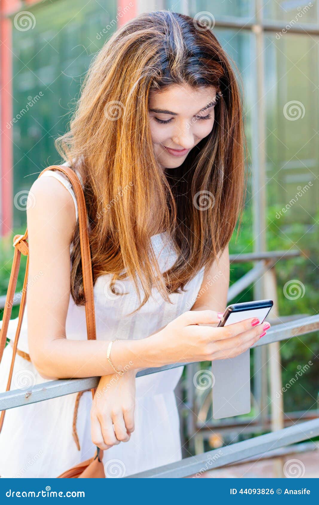 Smiling Girl Using Her Mobile Phone Stock Photo - Image of girl, mobile ...