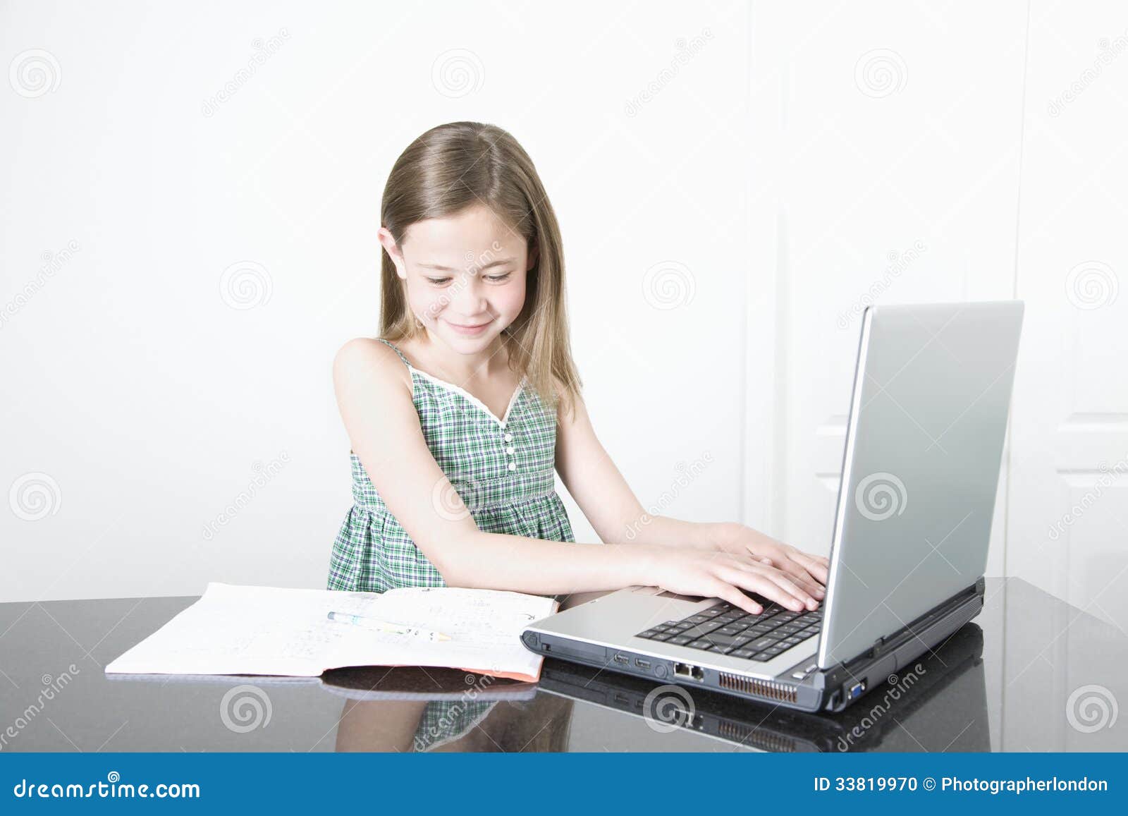 Smiling Girl Using Laptop stock photo. Image of house - 33819970