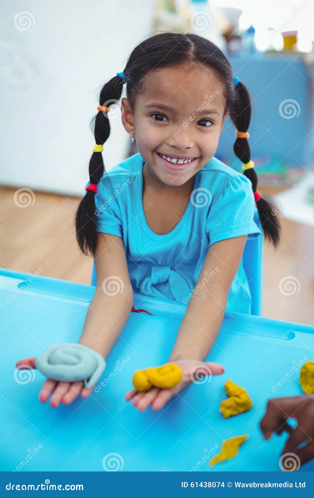 Smiling Girl Using Modelling Clay Stock Photo - Image of person, front ...