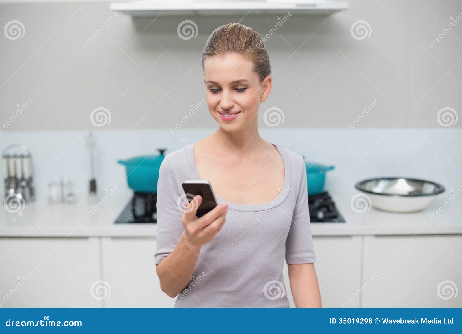 Smiling Gorgeous Model Holding Smartphone Stock Photo - Image of abode ...