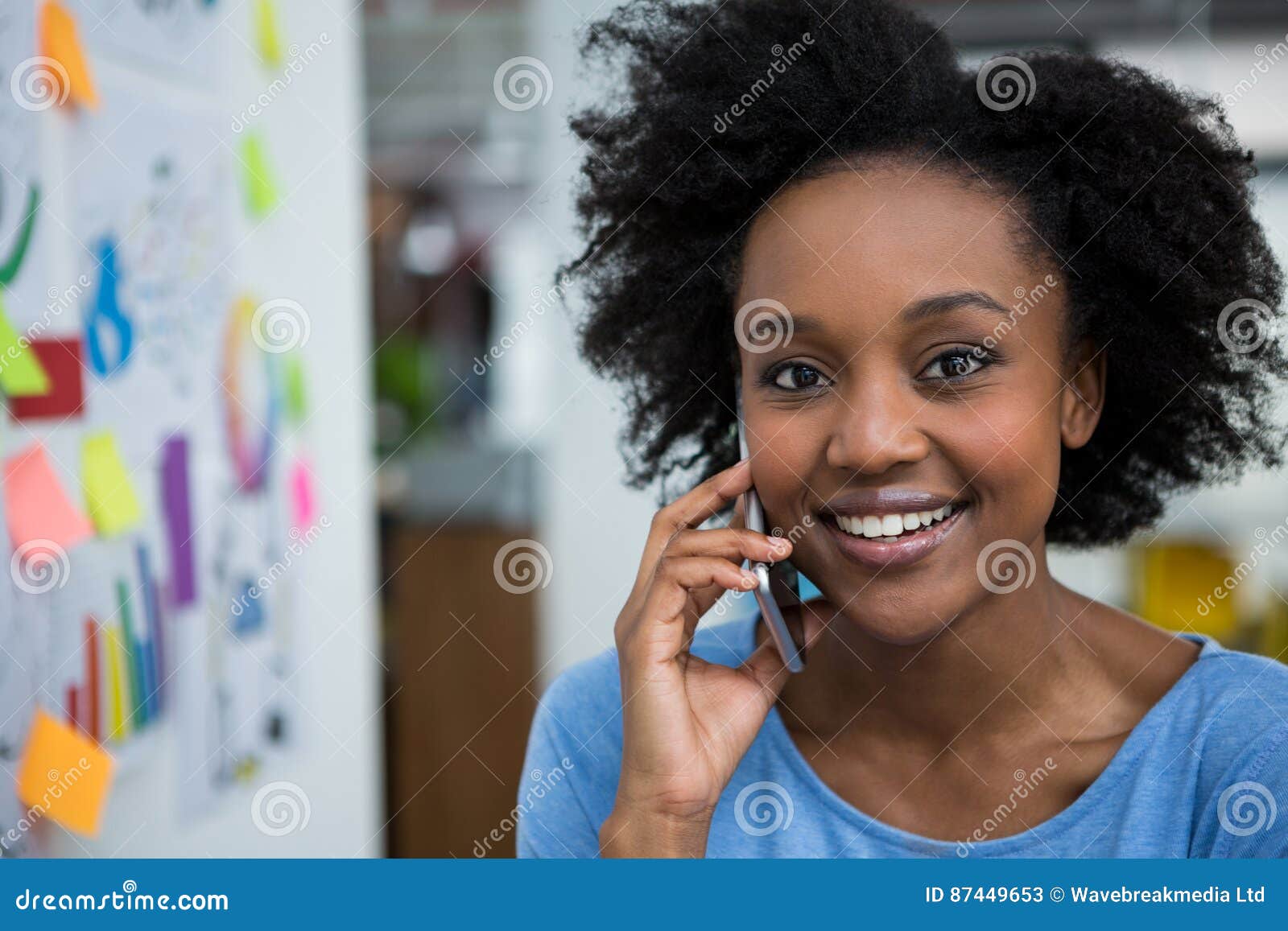 Smiling Graphic Designer Talking on Mobile Phone Stock Image - Image of ...