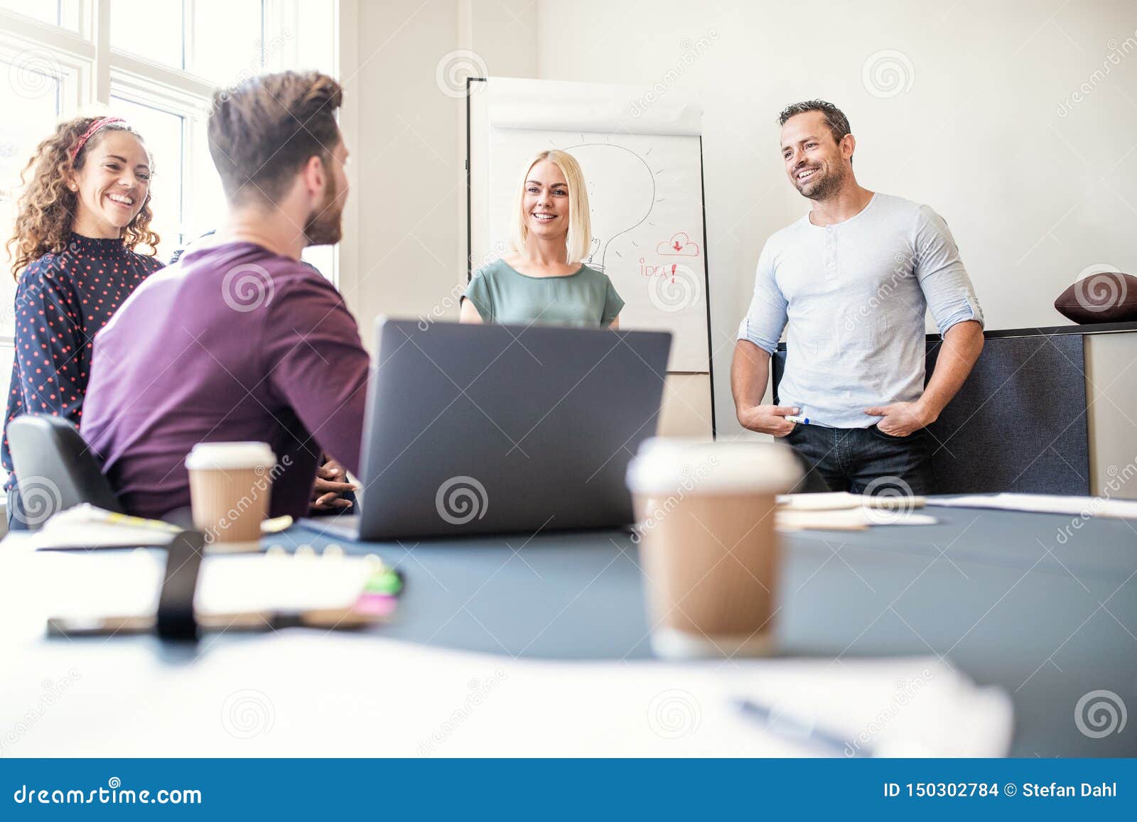 Smiling Group of Designers Talking Together after a Boardroom Pr Stock ...
