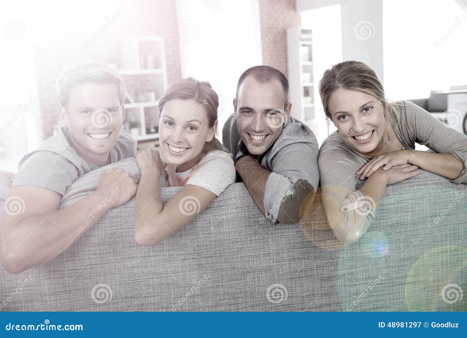 Smiling Group of Friends Sitting on a Sofa Stock Image - Image of ...