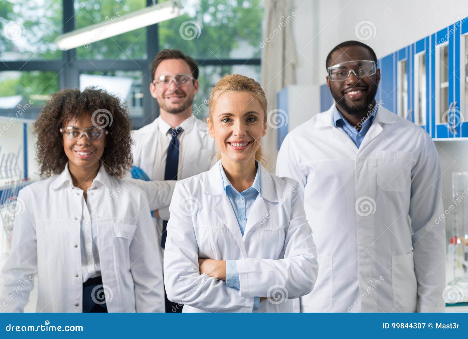 Smiling Group of Scientists in Modern Laboratory with Female Leader ... Smiling Group of Scientists in Modern Laboratory with Female Leader ...