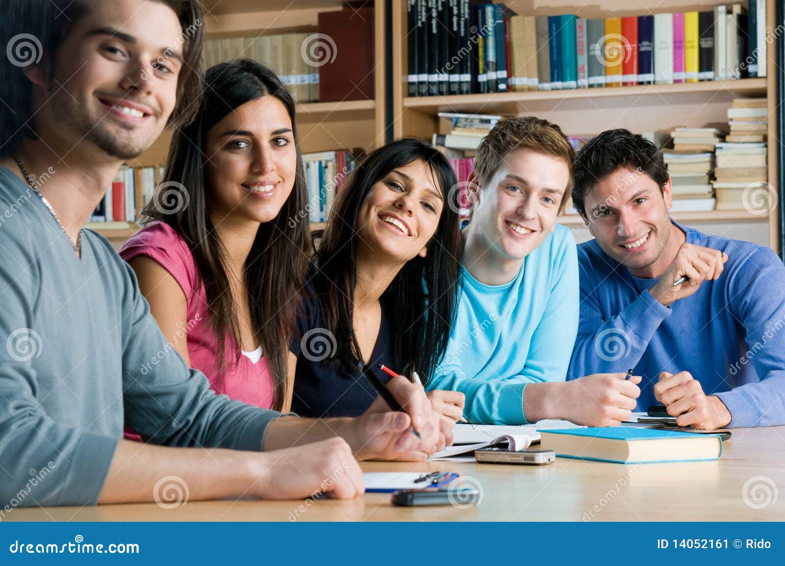 Smiling Group of Students in a Library Stock Image - Image of casual ...