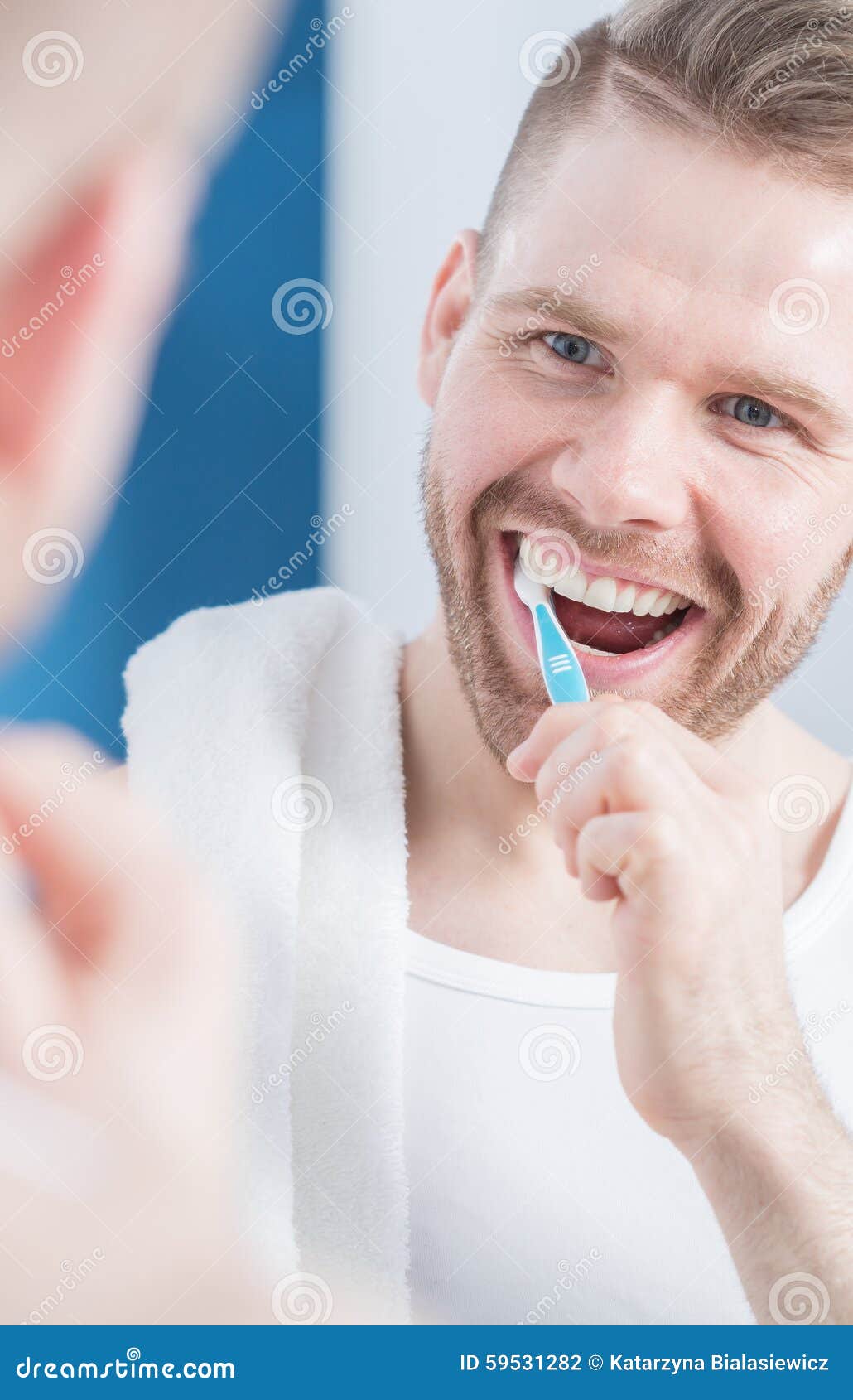 Smiling guy brushing teeth stock photo. Image of beauty - 59531282