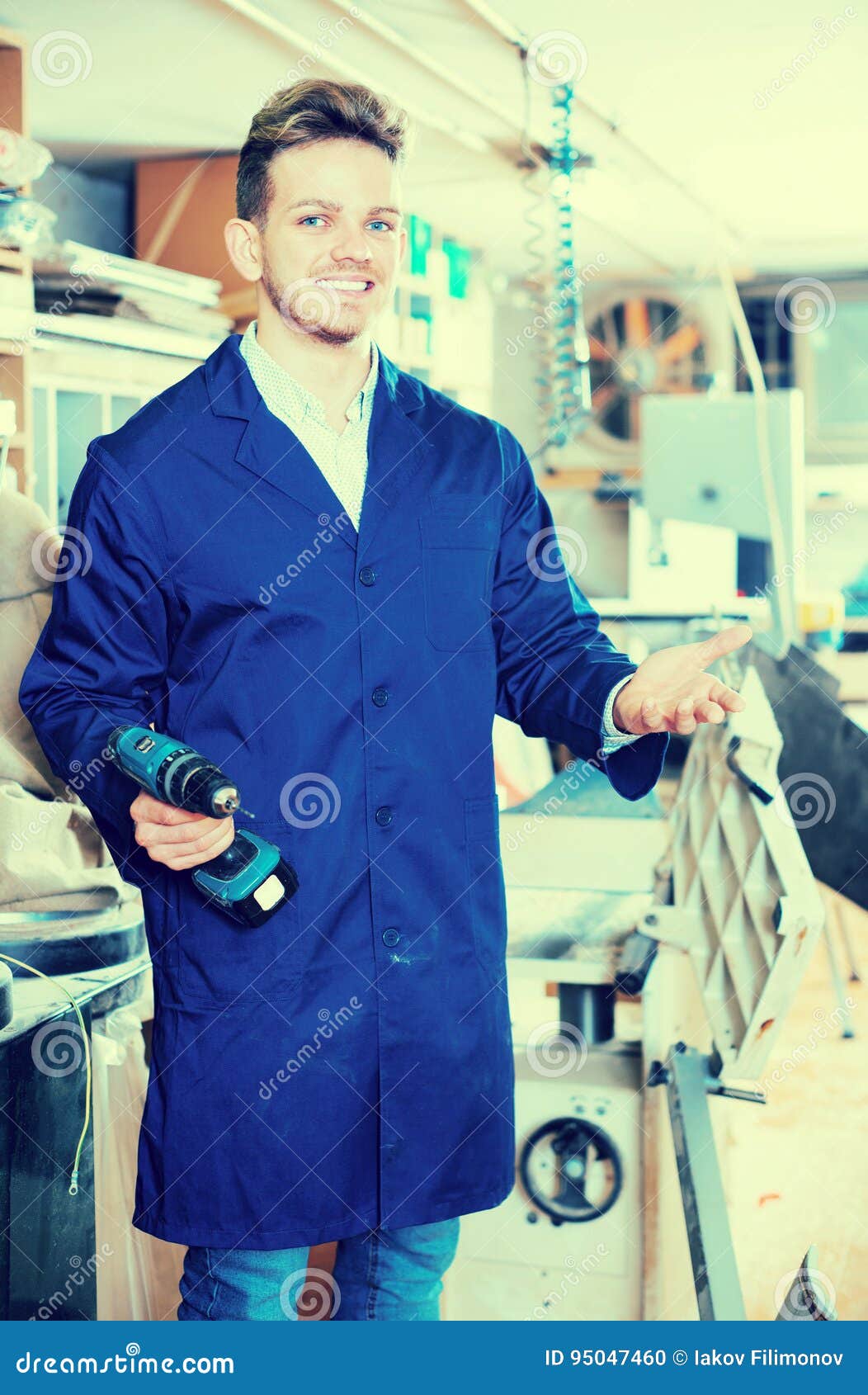 Smiling Guy Carpenter Working with Professional Drill Stock Photo ...