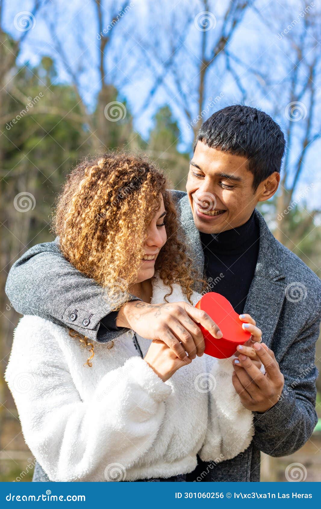 Smiling Guy Making Marriage Proposal To Smiling Girlfriend. Stock Photo ...