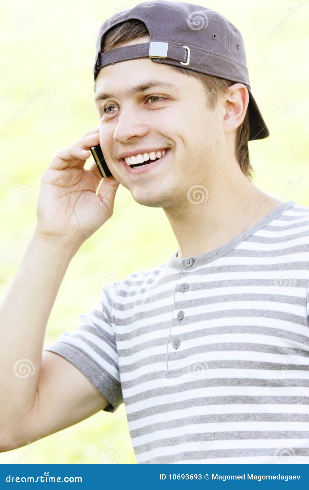Smiling guy with phone stock image. Image of mobile, person - 10693693