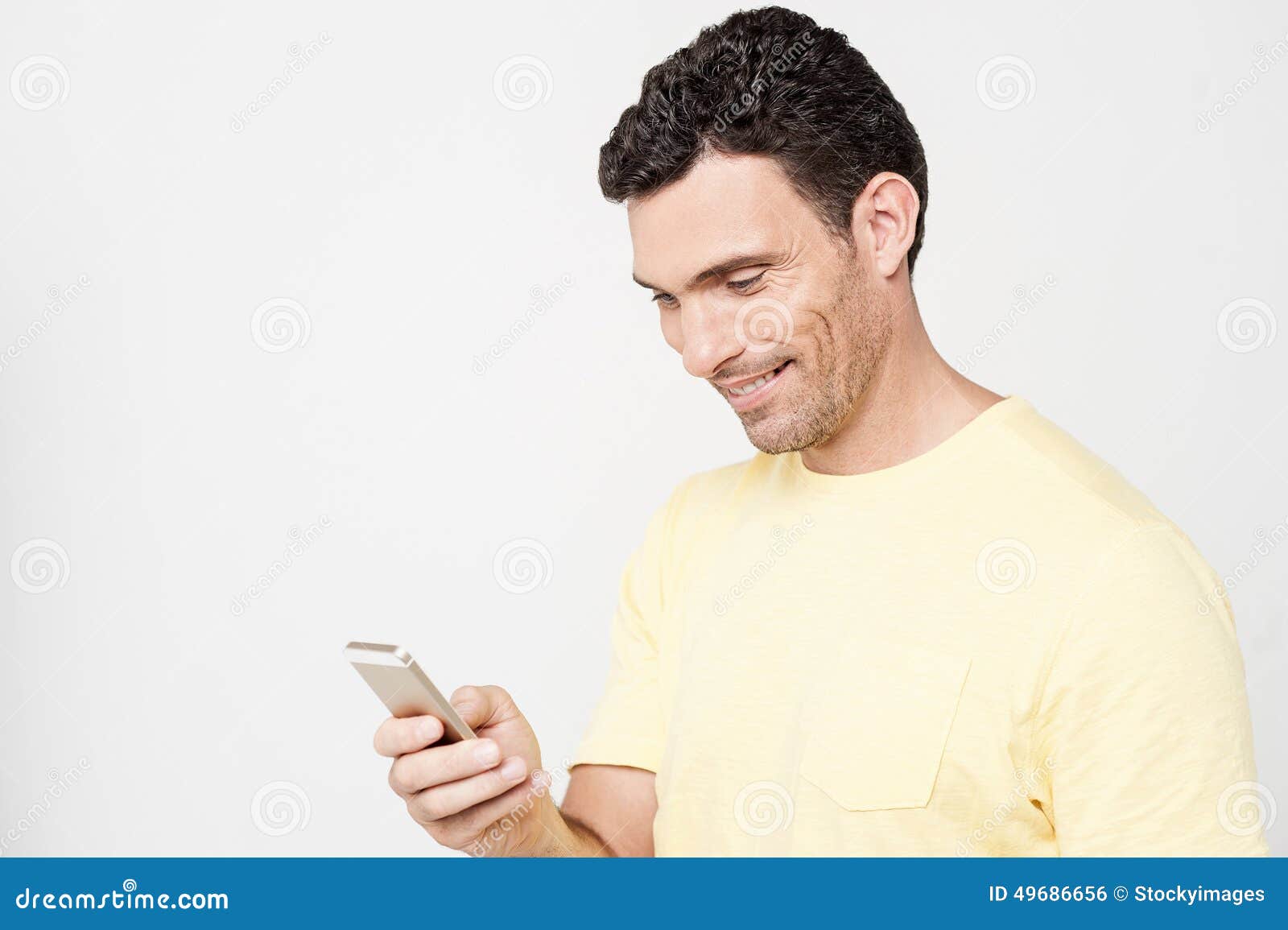 Smiling Guy Sending a Text Message Stock Photo - Image of cell, casual ...