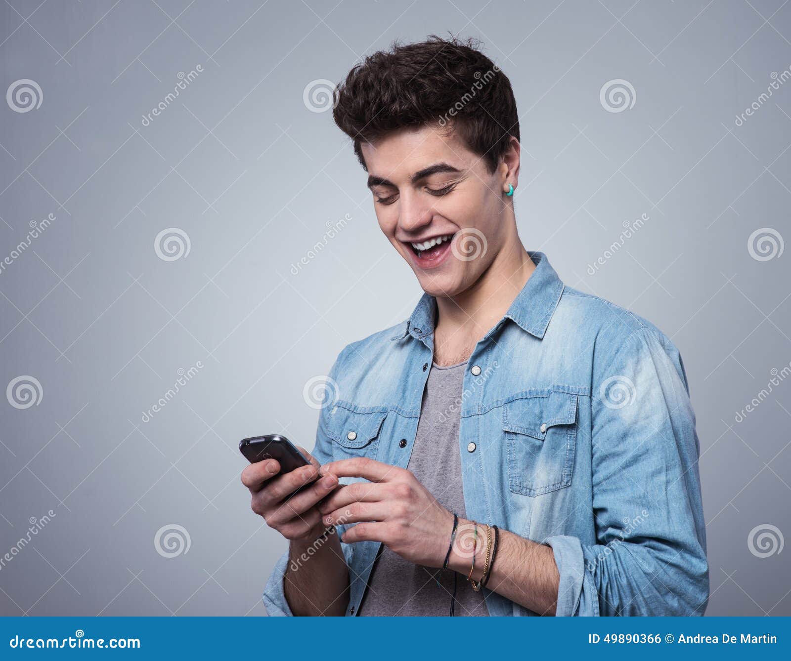 Smiling Guy Texting with Smartphone Stock Photo - Image of style ...