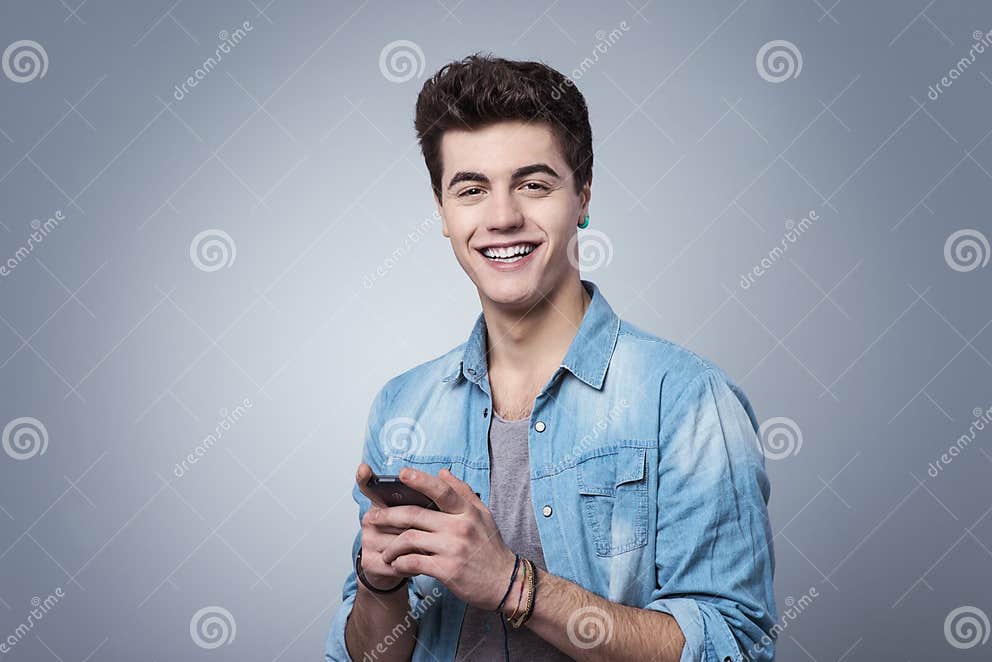 Smiling Guy Texting with Smartphone Stock Photo - Image of gray ...