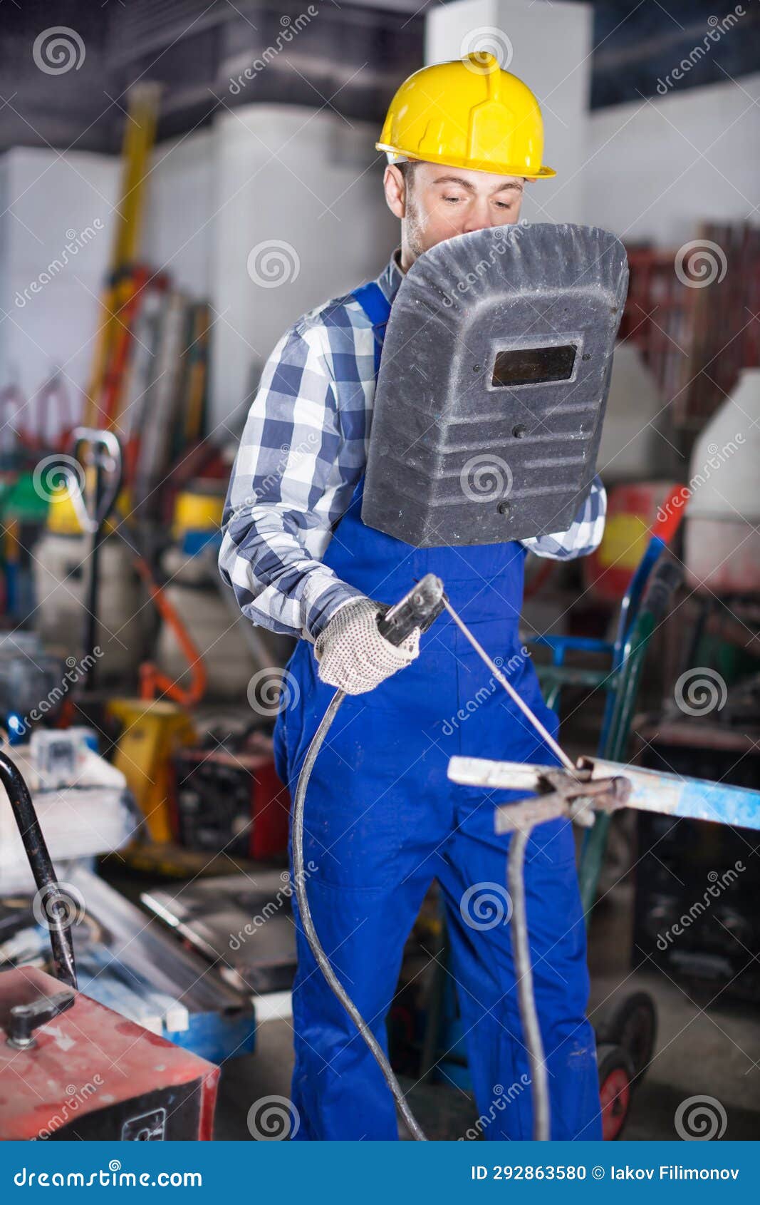 Smiling Guy Using Welder for Construction Work Stock Photo - Image of ...