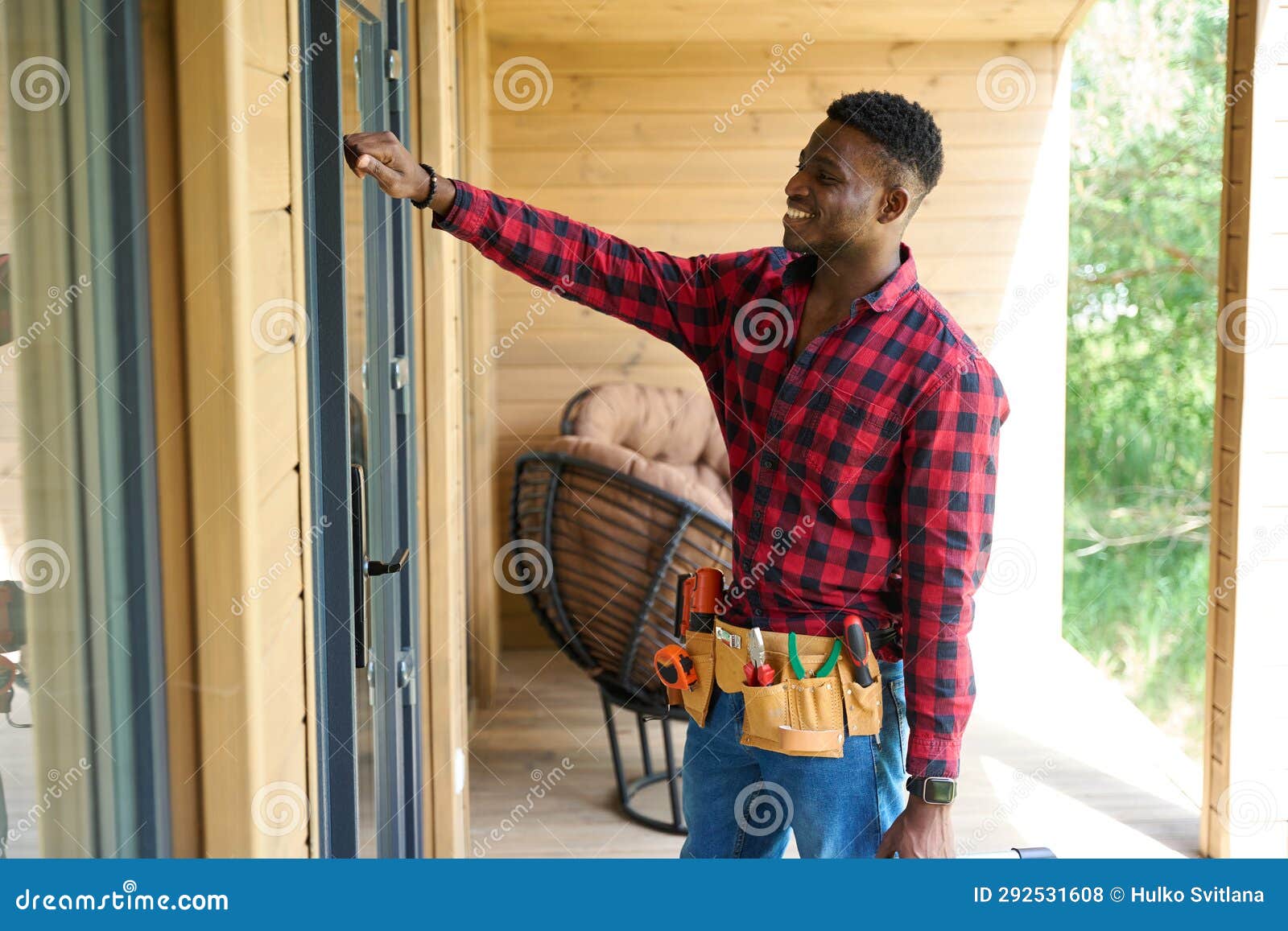 Smiling Guy with Work Tools is Knocking on the Door Stock Photo - Image ...