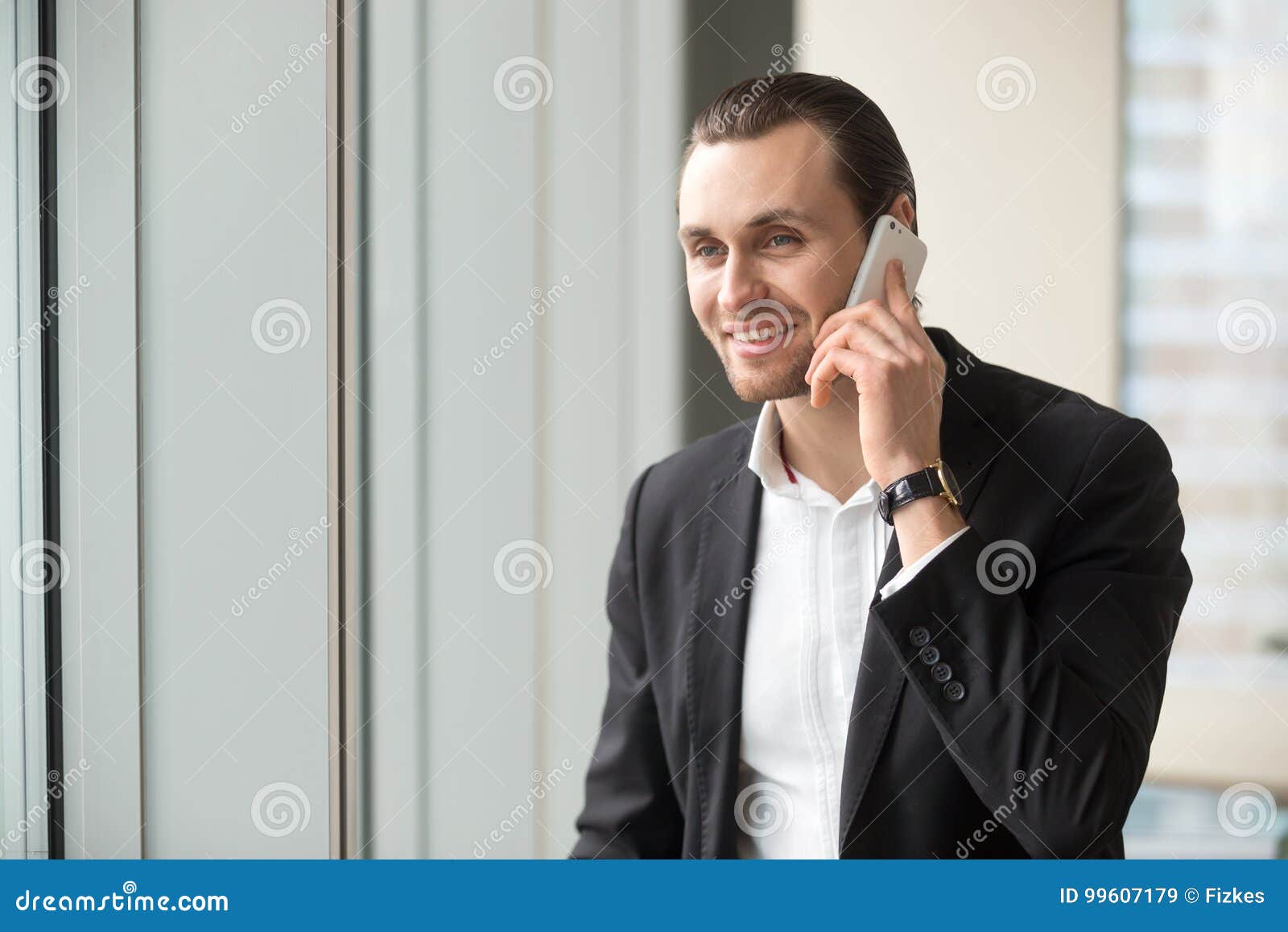 Smiling Handsome Businessman in Suit Talking on Cellphone. Stock Image ... Smiling Handsome Businessman in Suit Talking on Cellphone. Stock Image ...