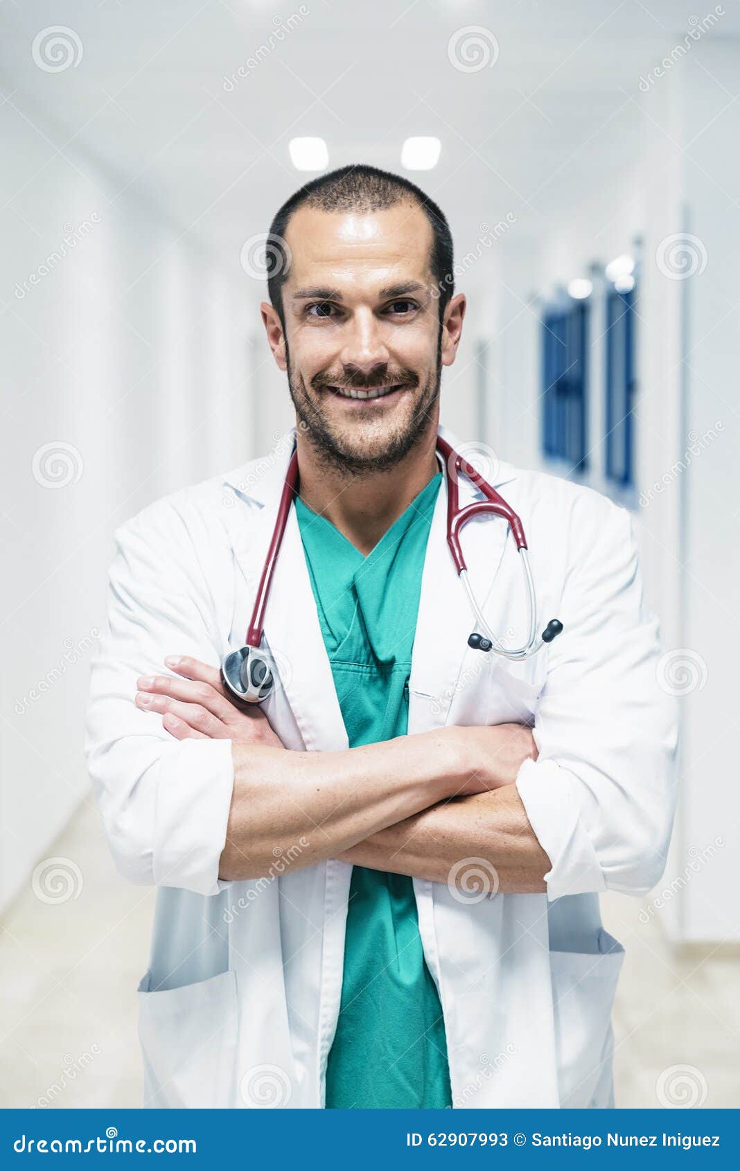 Smiling Handsome Doctor at Hospital. Standing Stock Image - Image of ...