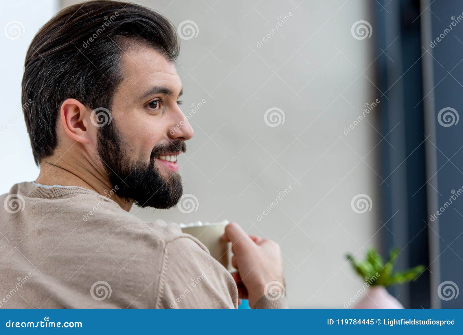 Smiling Handsome Man Holding Cup of Coffee with Marshmallow and Looking ...
