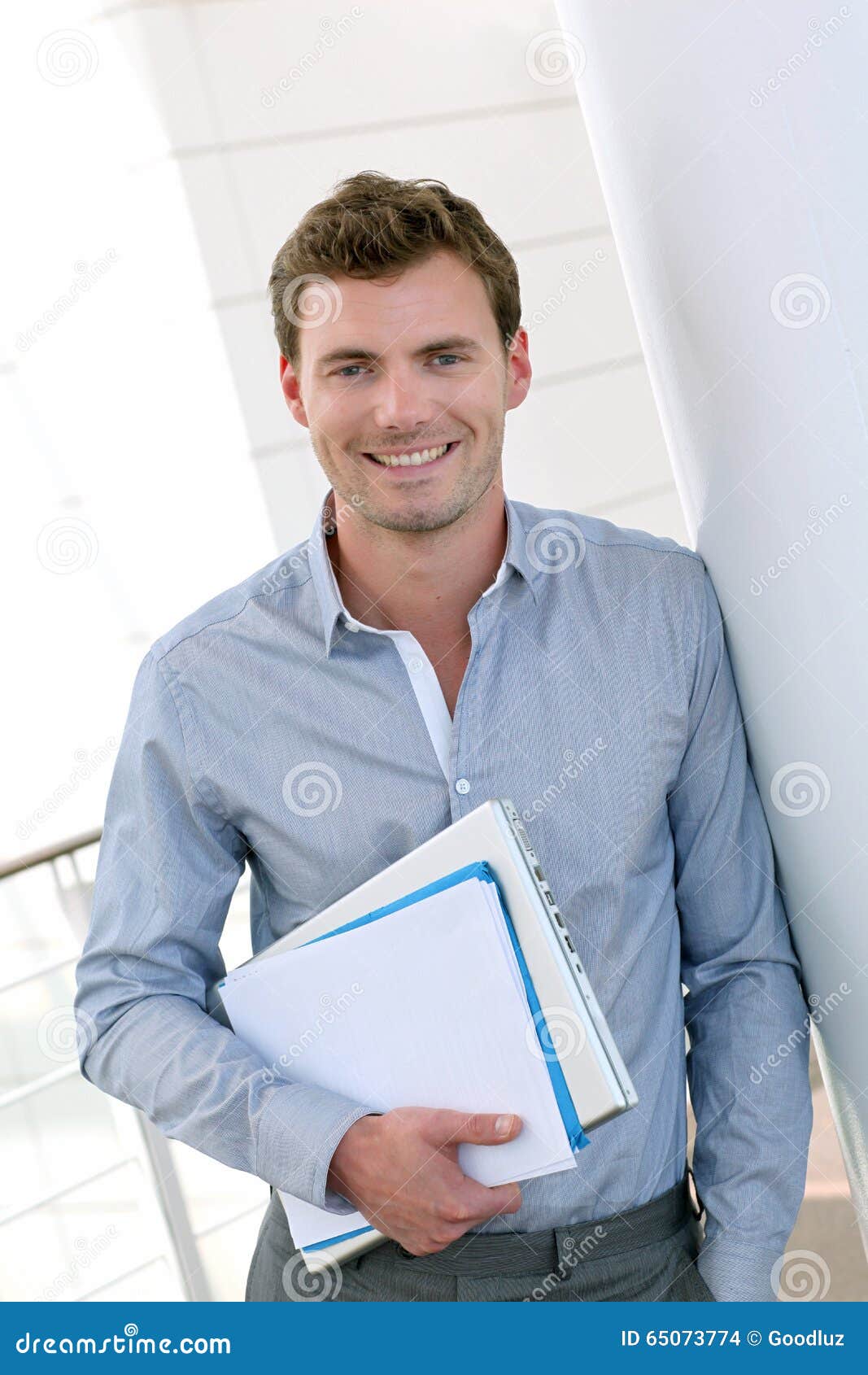 Smiling Handsome Man with Notebook Stock Photo - Image of standing ...