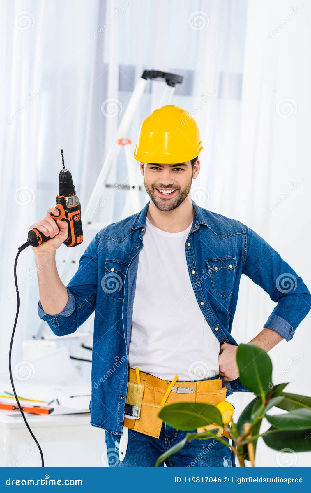 Smiling Handsome Man Standing with Drill and Looking Stock Photo ...