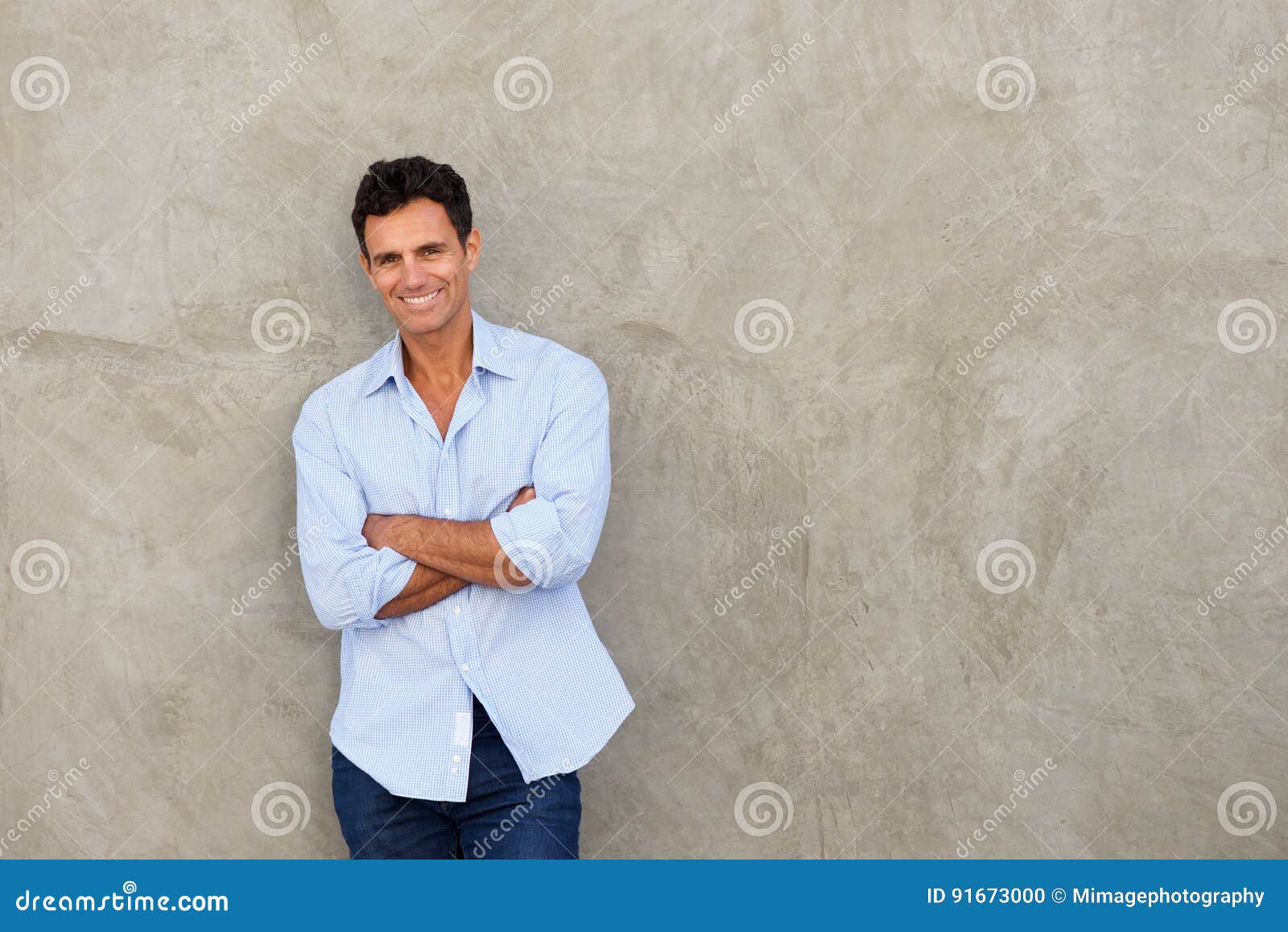 Smiling Handsome Middle Age Man Standing by Wall Stock Photo - Image of ...