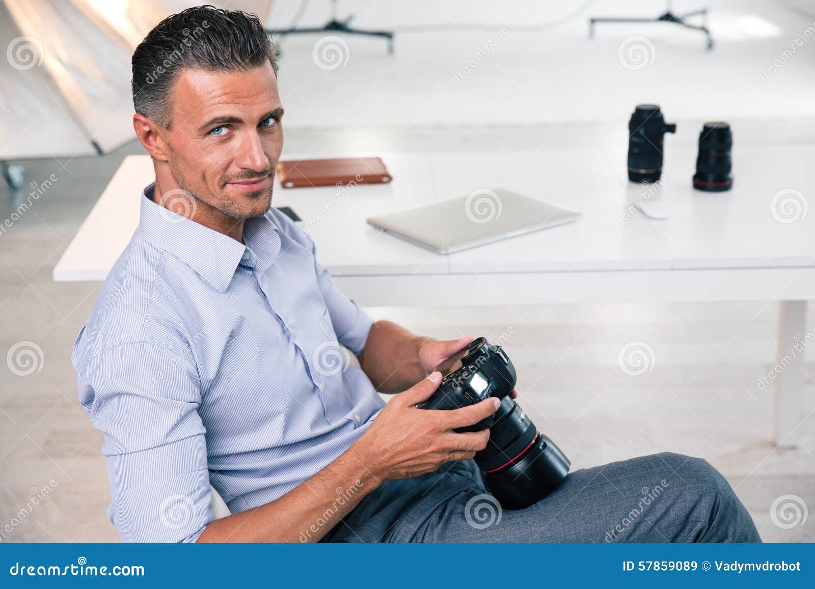 Smiling Handsome Photographer Using Camera Stock Image - Image of lens ...