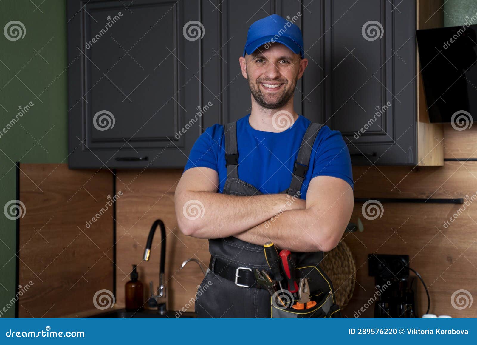 Smiling Handsome Plumber Standing with Crossed Arms and Looking at ...