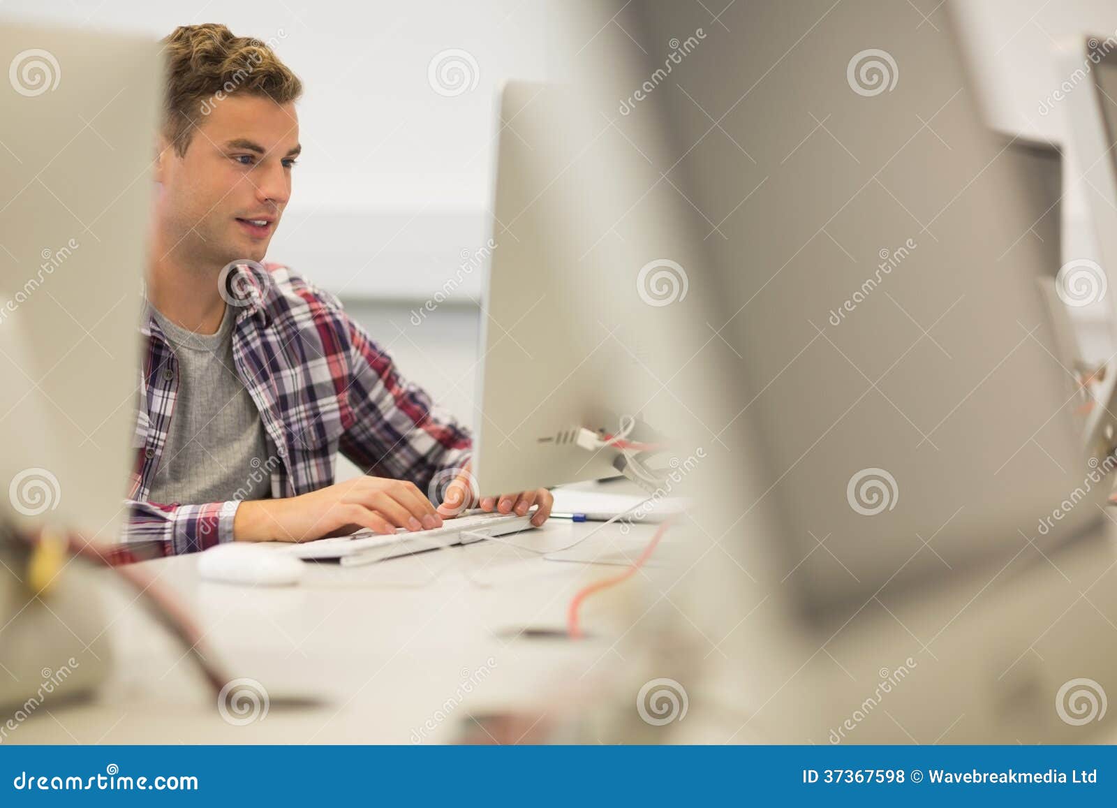 Smiling Handsome Student Studying in the Computer Room Stock Photo ...