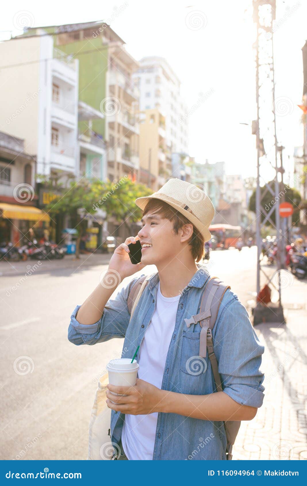 Smiling Handsome Young Man Drinking Coffee and Using Smart Phone Stock ... Smiling Handsome Young Man Drinking Coffee and Using Smart Phone Stock ...
