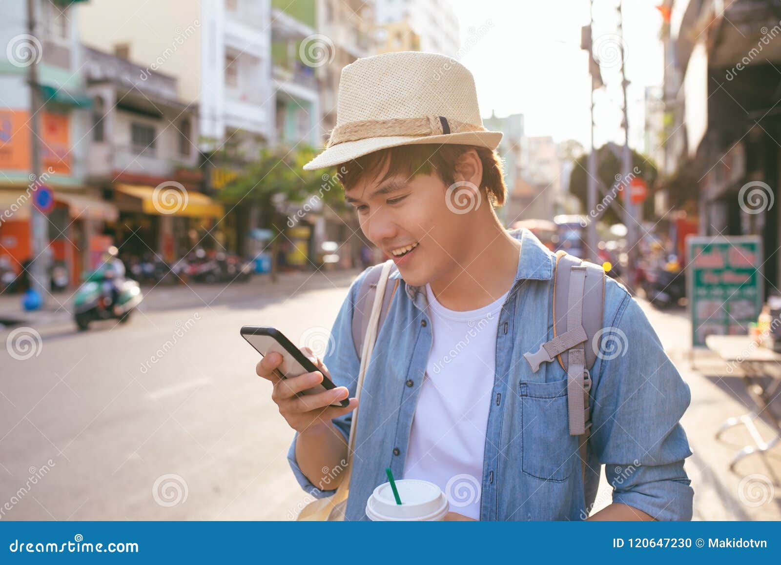 Smiling Handsome Young Man Drinking Coffee and Using Smart Phone Stock ... Smiling Handsome Young Man Drinking Coffee and Using Smart Phone Stock ...