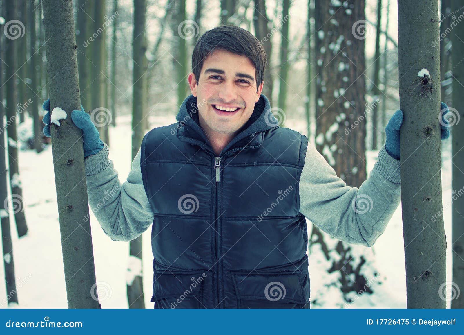 Smiling Handsome Young Man Holding Trees Stock Image - Image of forest ...