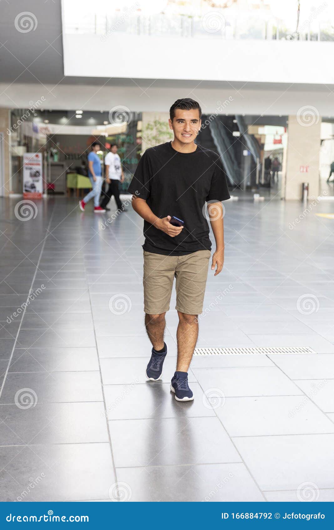 Young Man Walking in the Mall Stock Photo - Image of lifestyle, young ...
