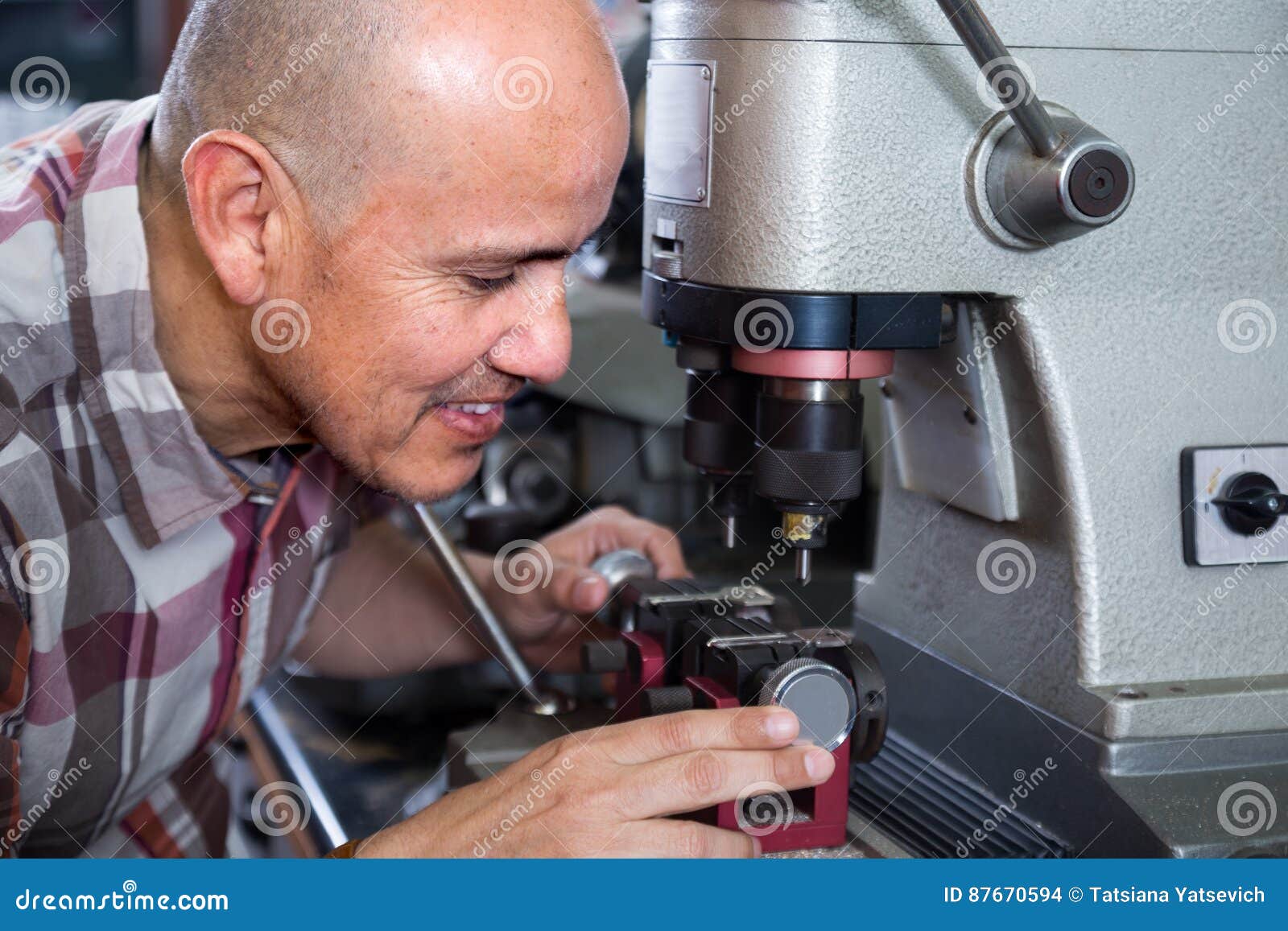 Smiling Handyman Making Duplicates of Door Keys Stock Photo - Image of ...