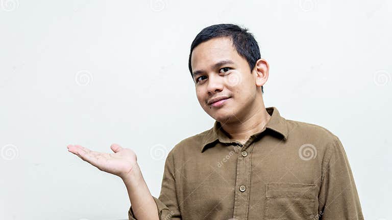 Smiling And Happy Face Expression Of Young Asian Malay Man With Hand