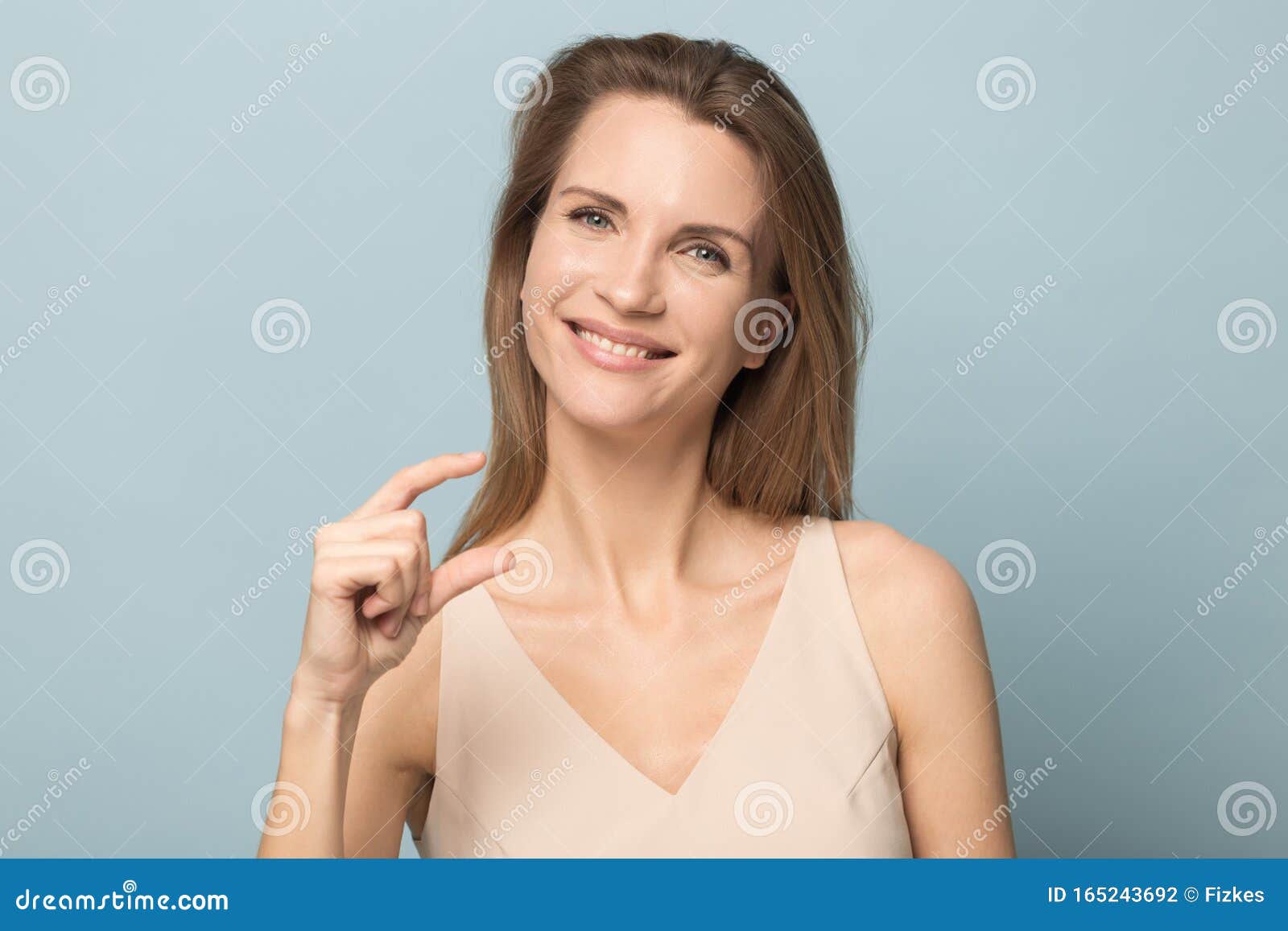 Smiling Happy Woman Showing Little Size Gesture with Fingers Stock ...