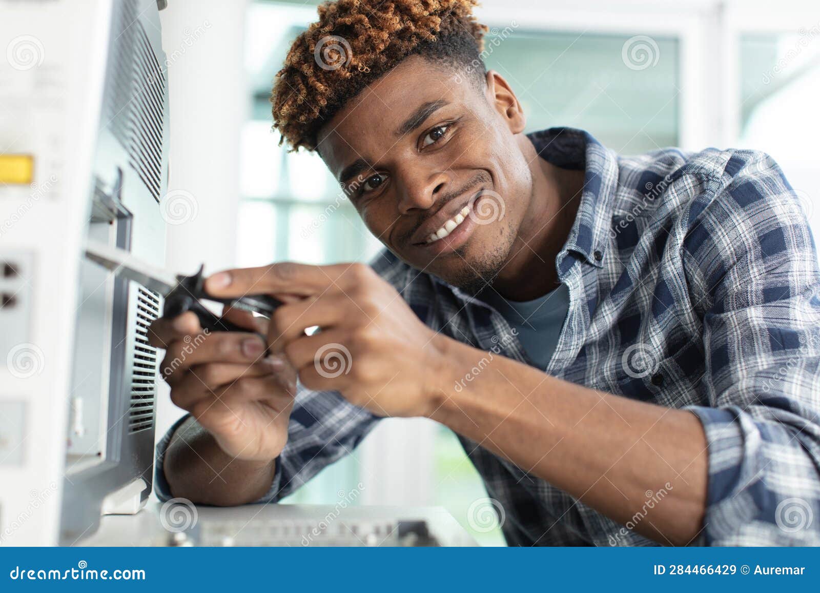 Smiling Hardware Store Worker Fixing Something Stock Image - Image of ...