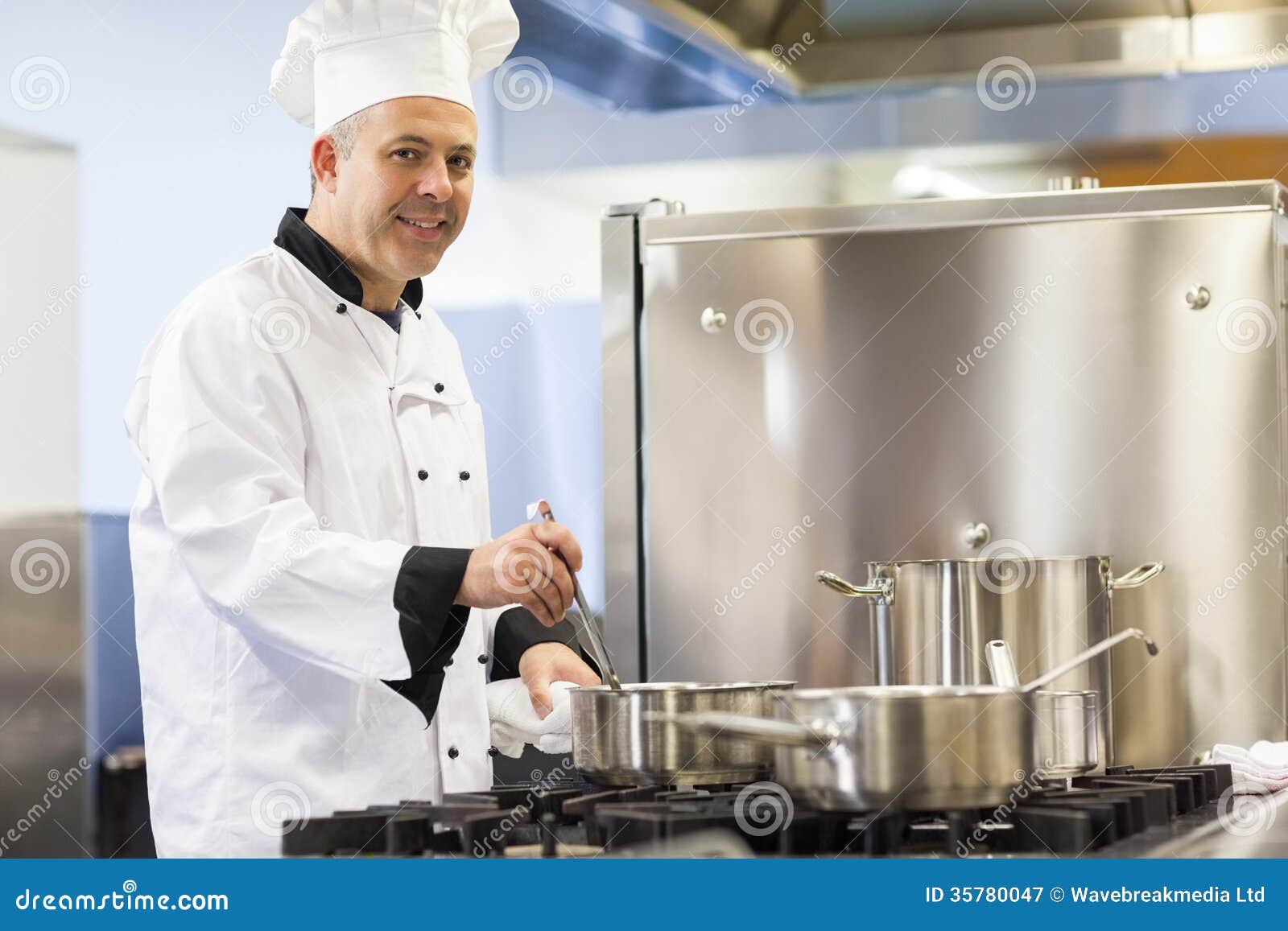 Smiling Head Chef Stirring in Pot Stock Image - Image of chef, catering ...