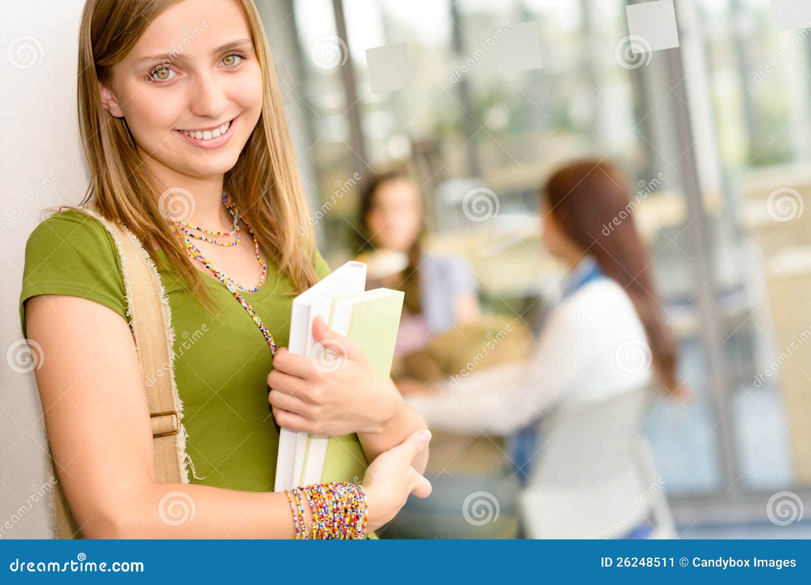 Smiling High School Student with Books Stock Image - Image of green ...
