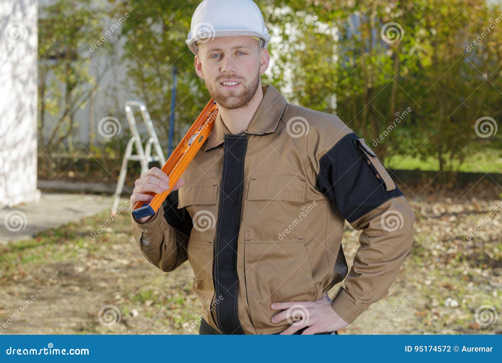 Smiling Home Inspector Holding Level at Construction Site Stock Photo ...
