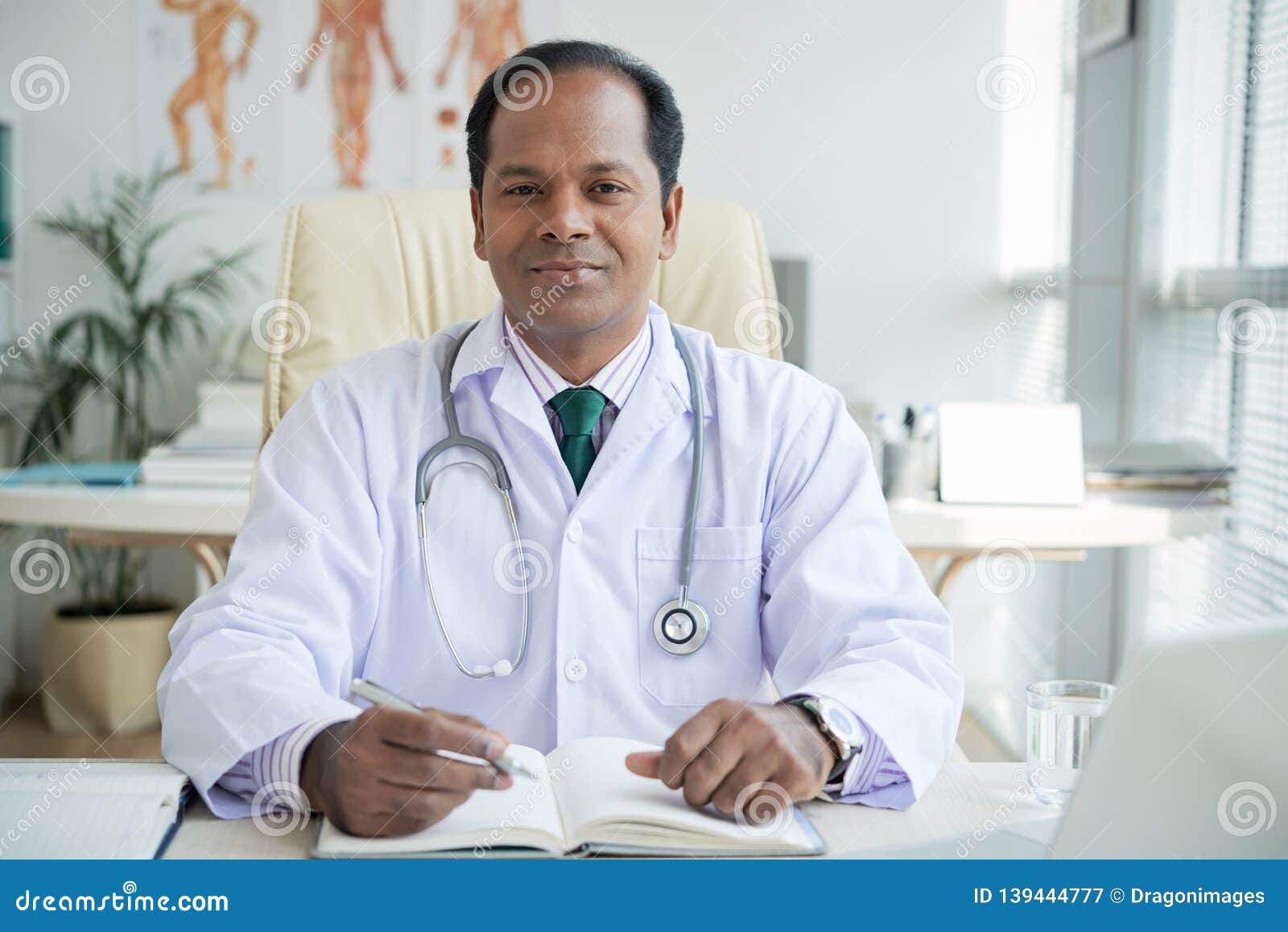 Smiling Indian General Practitioner Stock Image - Image of workspace ...