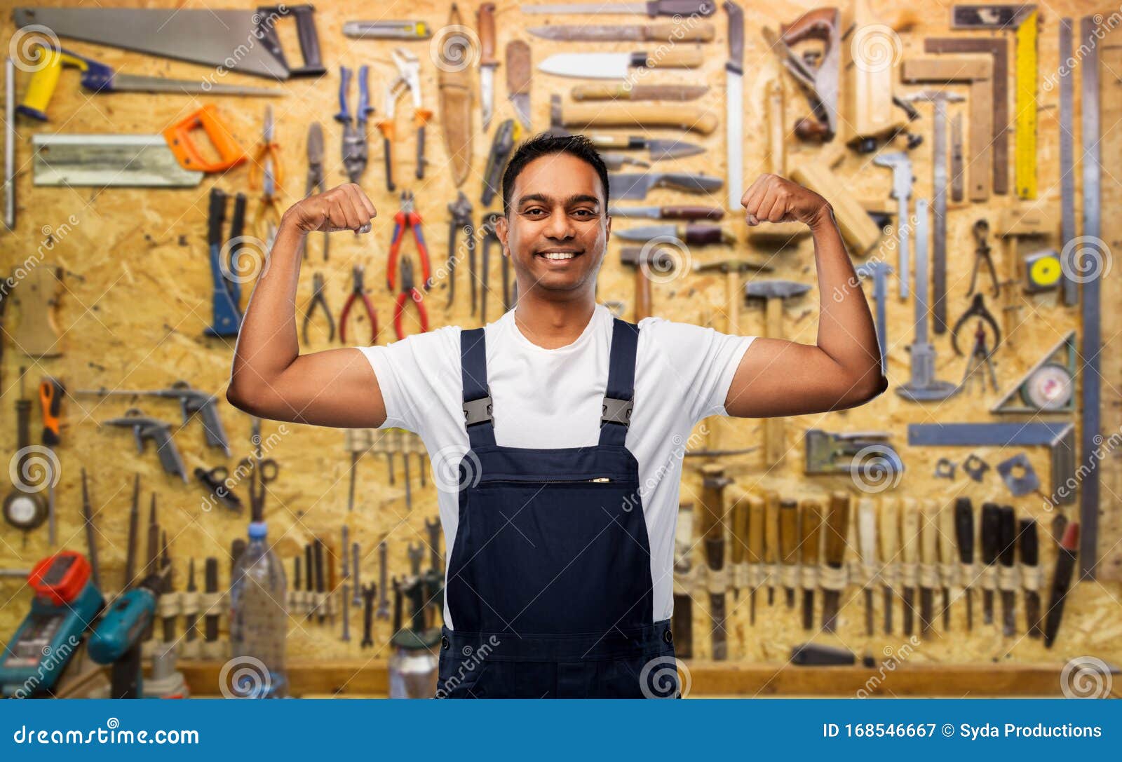 Smiling Indian Worker or Builder Showing His Power Stock Image - Image ...