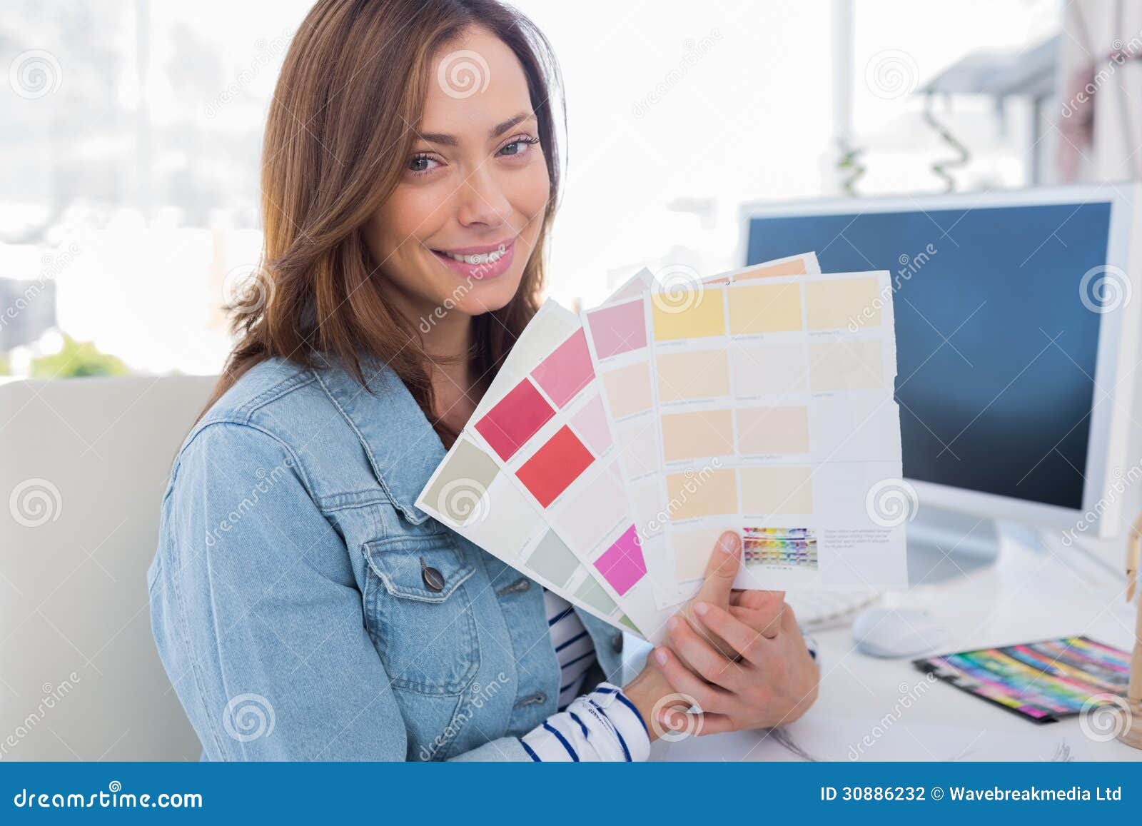 Smiling Interior Designer Holding Up Colour Samples Stock Photo - Image ...