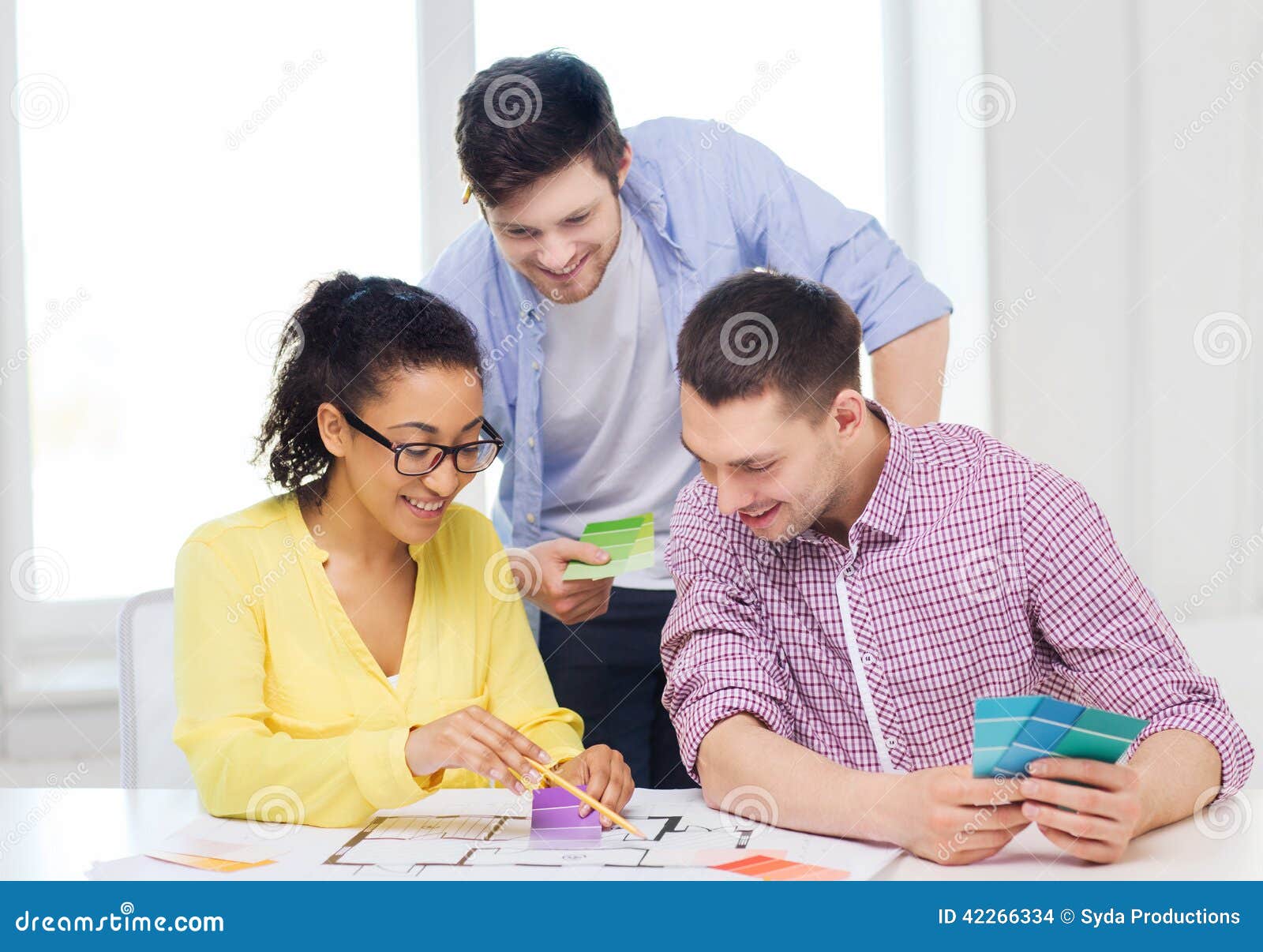 Smiling Interior Designers Working in Office Stock Photo - Image of ...