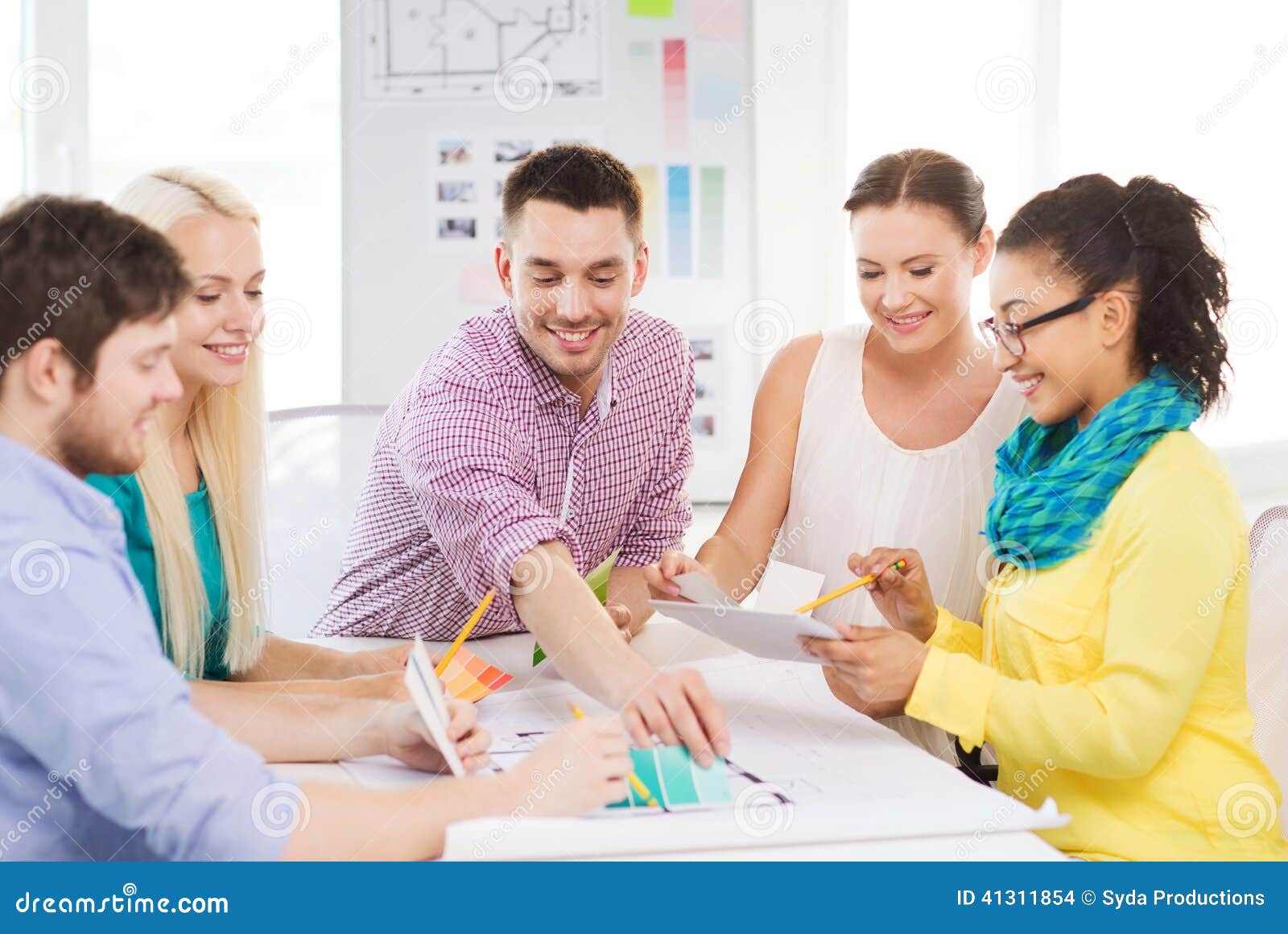 Smiling Interior Designers Working in Office Stock Photo - Image of ...
