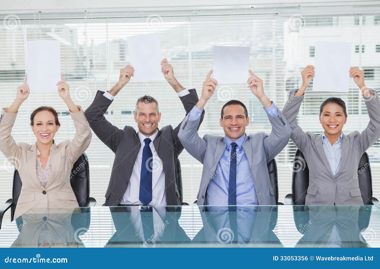 Smiling Interview Panel Holding Blank Sheets Above Their Head Hi Stock ...