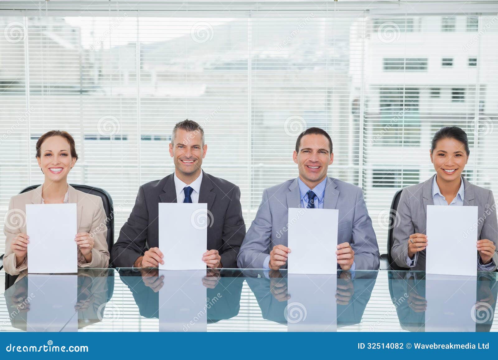 Smiling Interview Panel Holding White Paper Stock Photo - Image of ...
