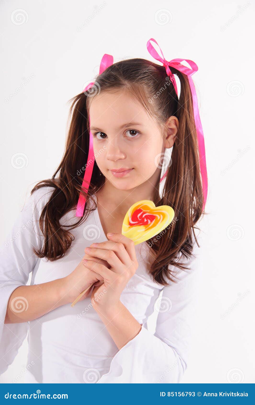Smiling kid with candy stock image. Image of curly, shirt - 85156793
